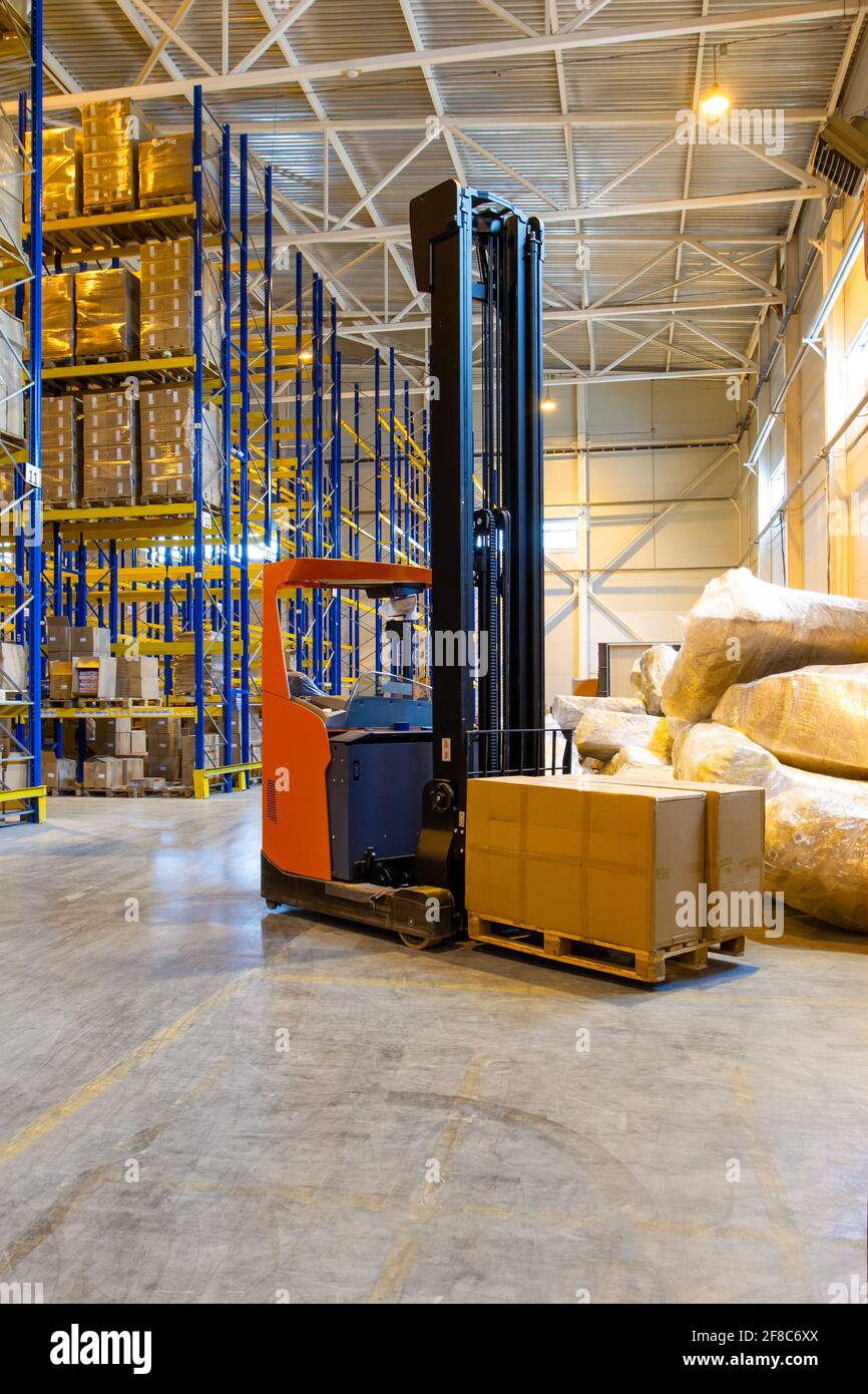 Interior of a modern warehouse storage with rows and goods boxes on ...
