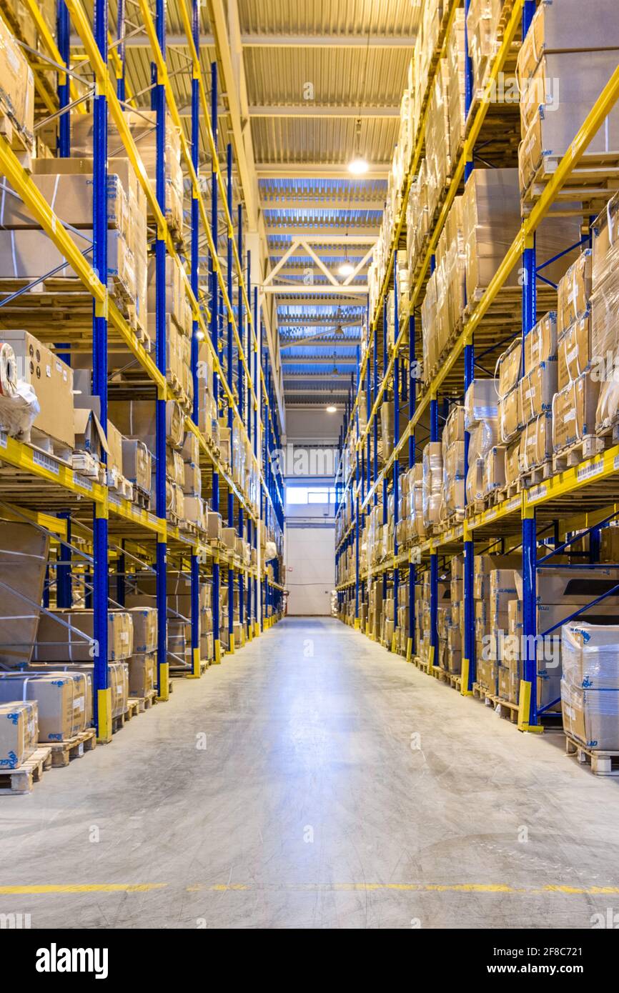Interior of a modern warehouse storage with rows and goods boxes on ...