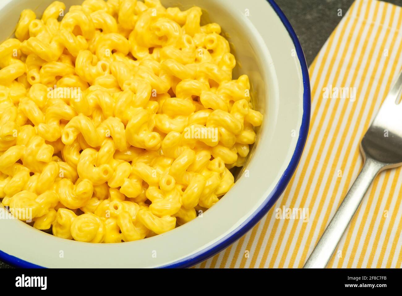Pasta background. Mac and Cheese pasta on a kitchen background ...