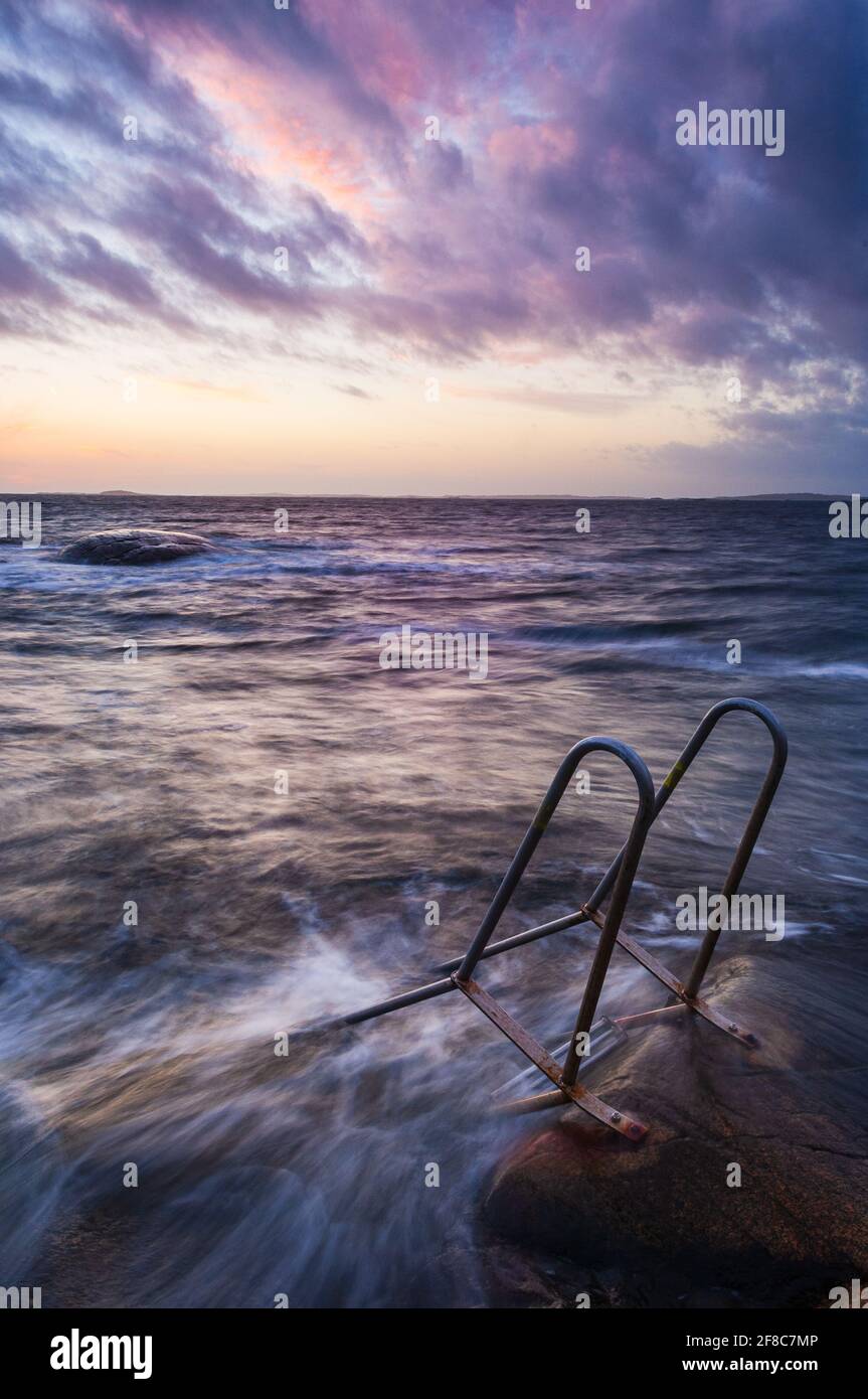 Bath ladder at the coast Stock Photo - Alamy