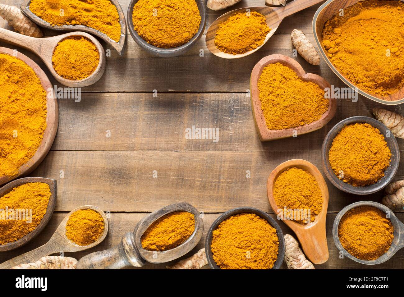 Turmeric powder and fresh turmeric - Curcuma longa Stock Photo - Alamy