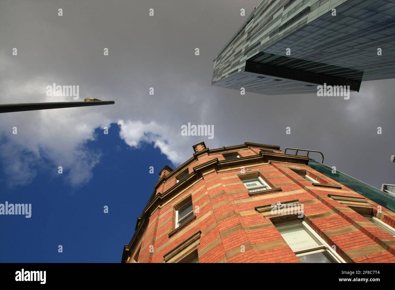 lamp post, modern and Victorian buildings looking skywards, Manchester ...