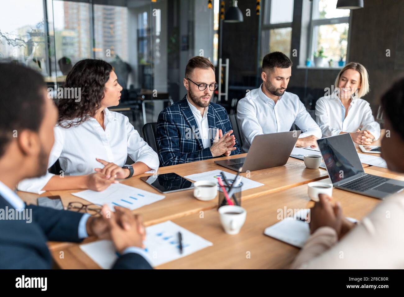 Person presenting colleagues during hi-res stock photography and images ...