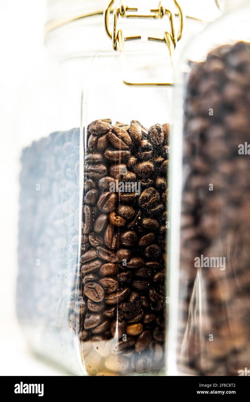 Vertical shot of glass jars filled with coffee beans Stock Photo - Alamy