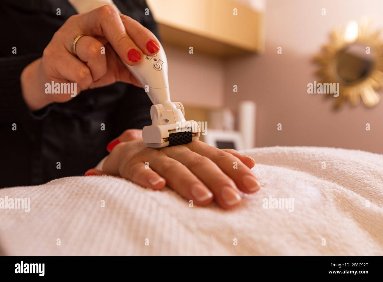 woman's hands receive a hand skin care procedure. beauty care concept ...