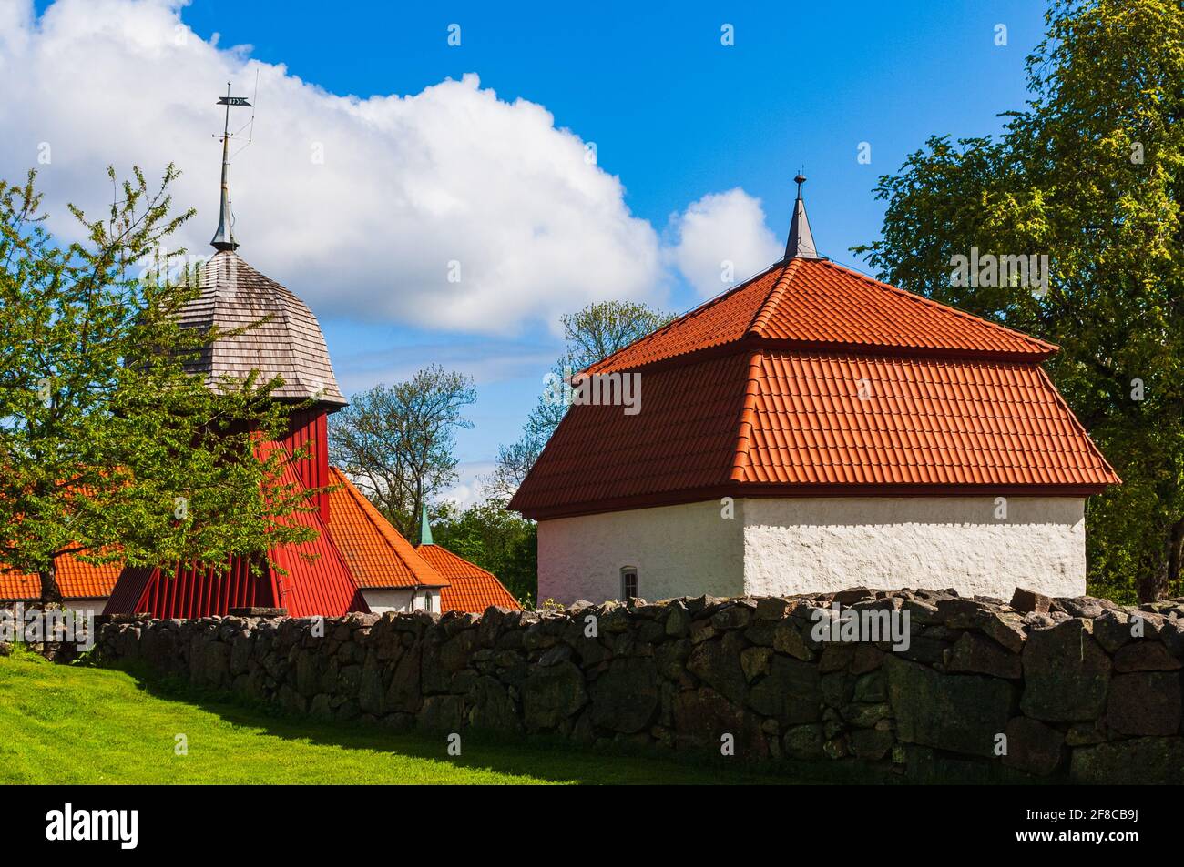 Stone wall in front of old church Stock Photo - Alamy