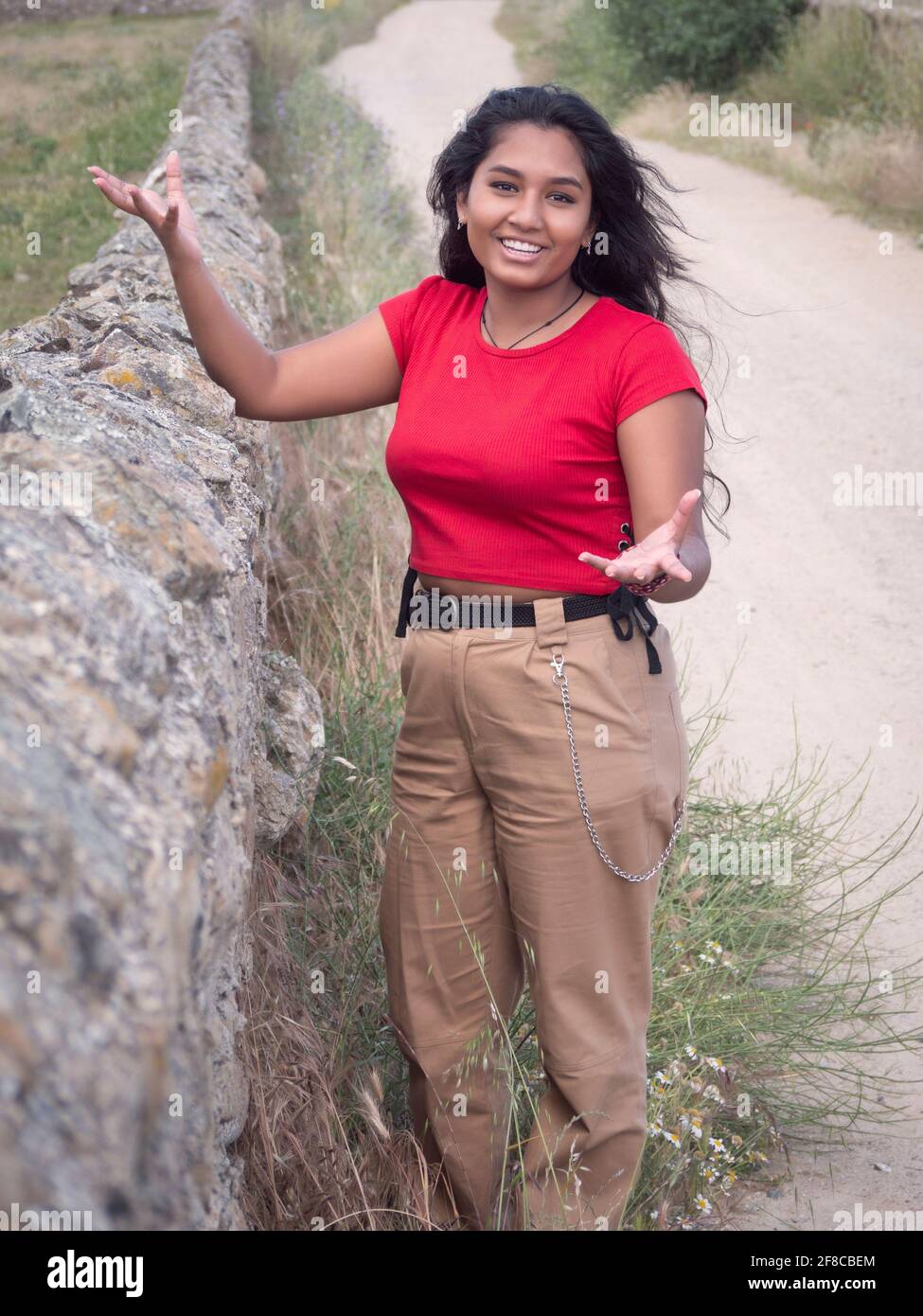 Asian teen making happy funny gestures Stock Photo - Alamy