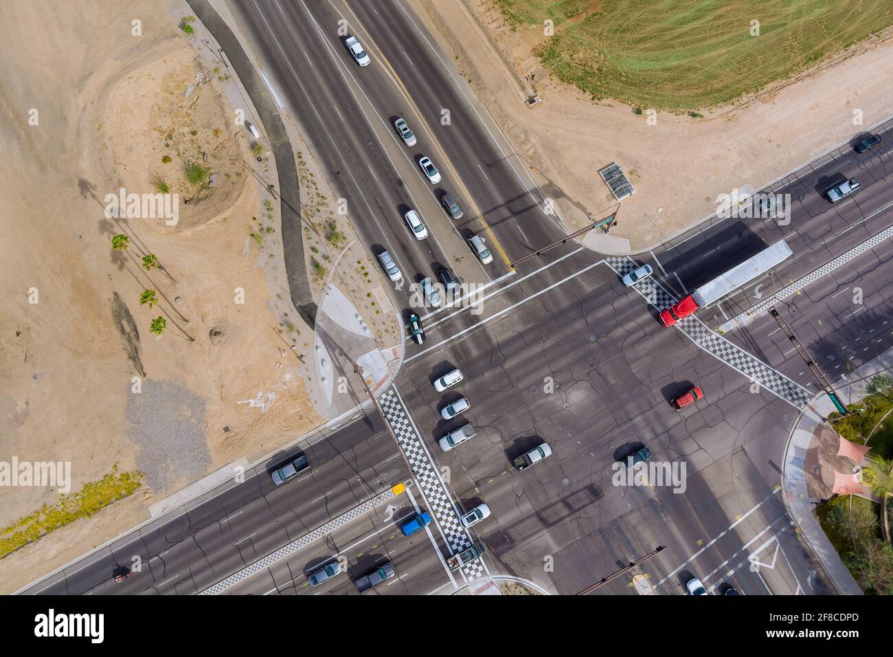 Major asphalt road with multiple lanes, with a traffic light a ...