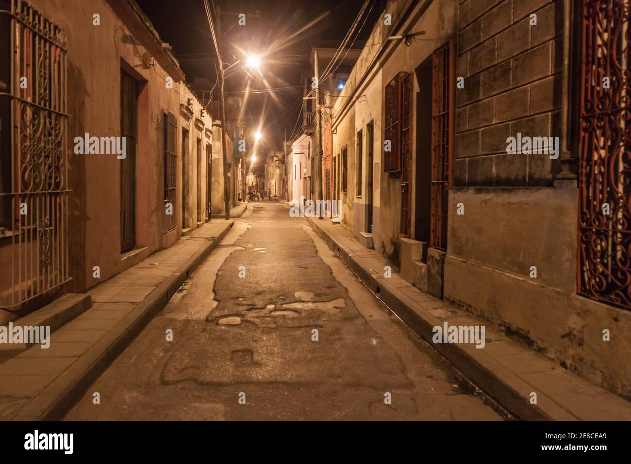 Narrow alley in Camaguey, Cuba Stock Photo - Alamy