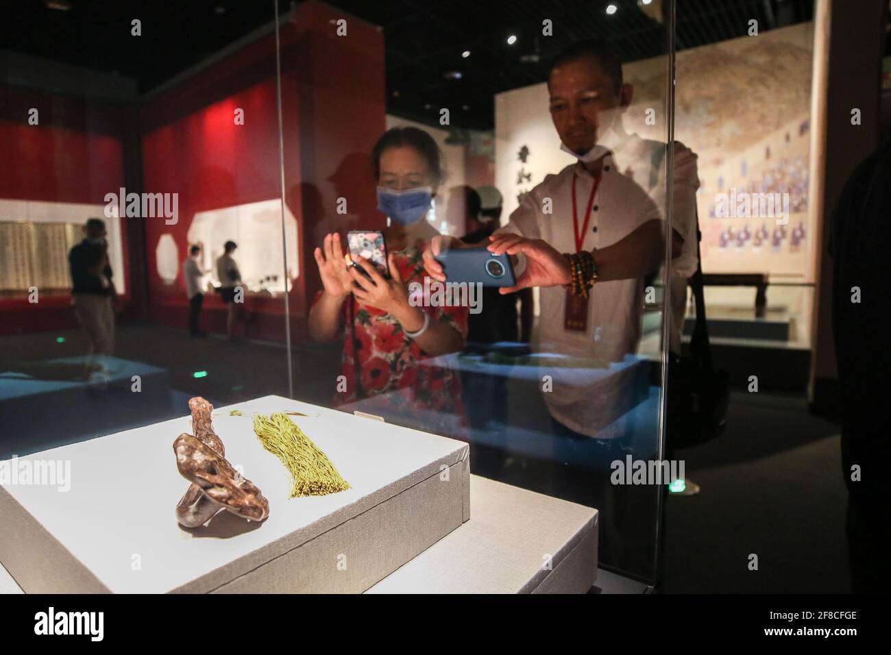 Haikou, China's Hainan Province. 13th Apr, 2021. Visitors view exhibits ...