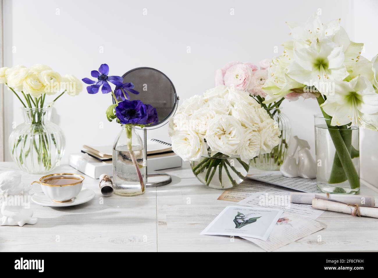 London, UK -20 March 2021, white roses, pink ranunculus, blue anemones ...