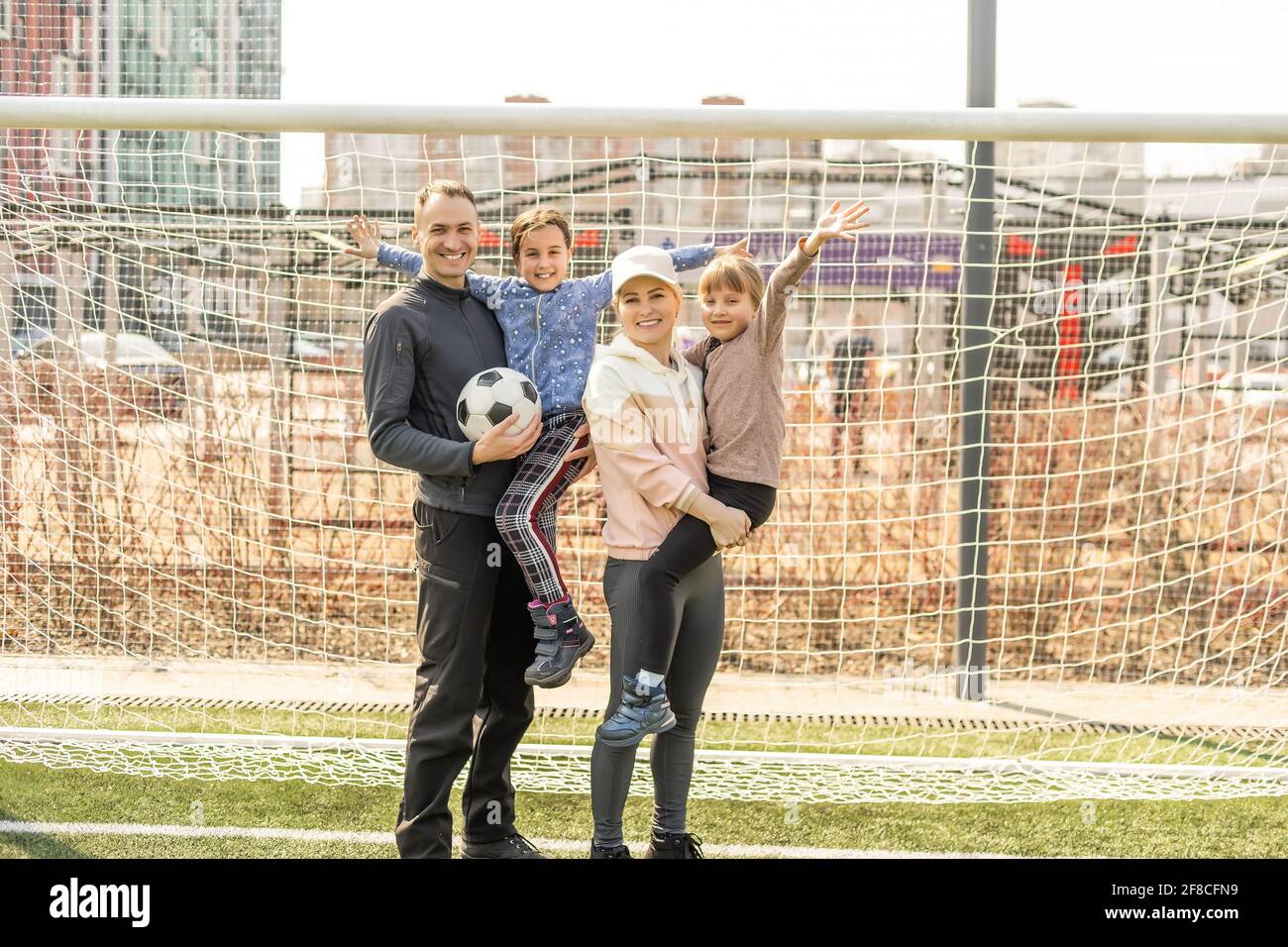 family and ball on the grass in the stadium Stock Photo - Alamy