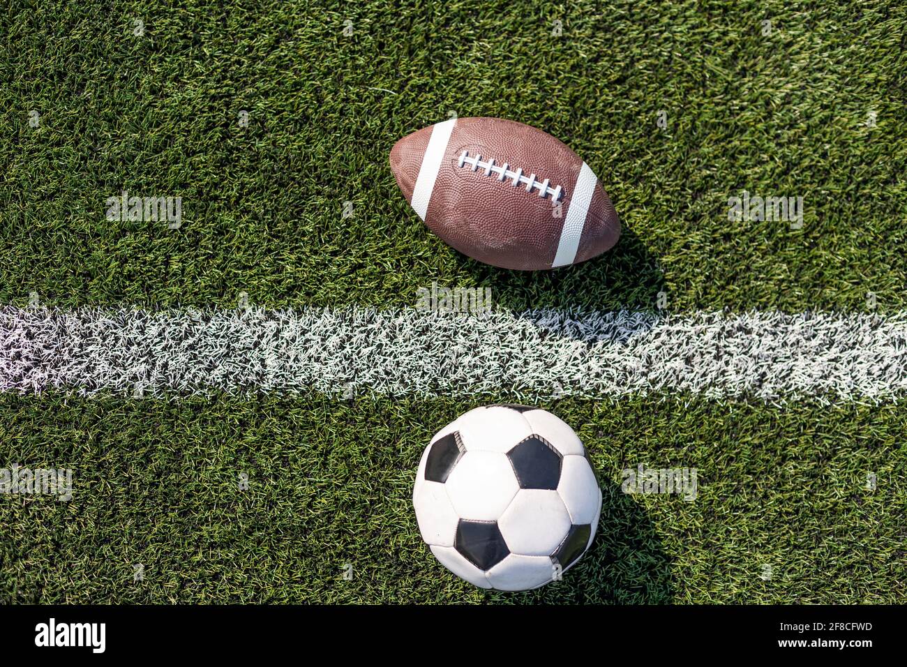 soccer field and stadium, rugby ball and soccer ball at the stadium ...