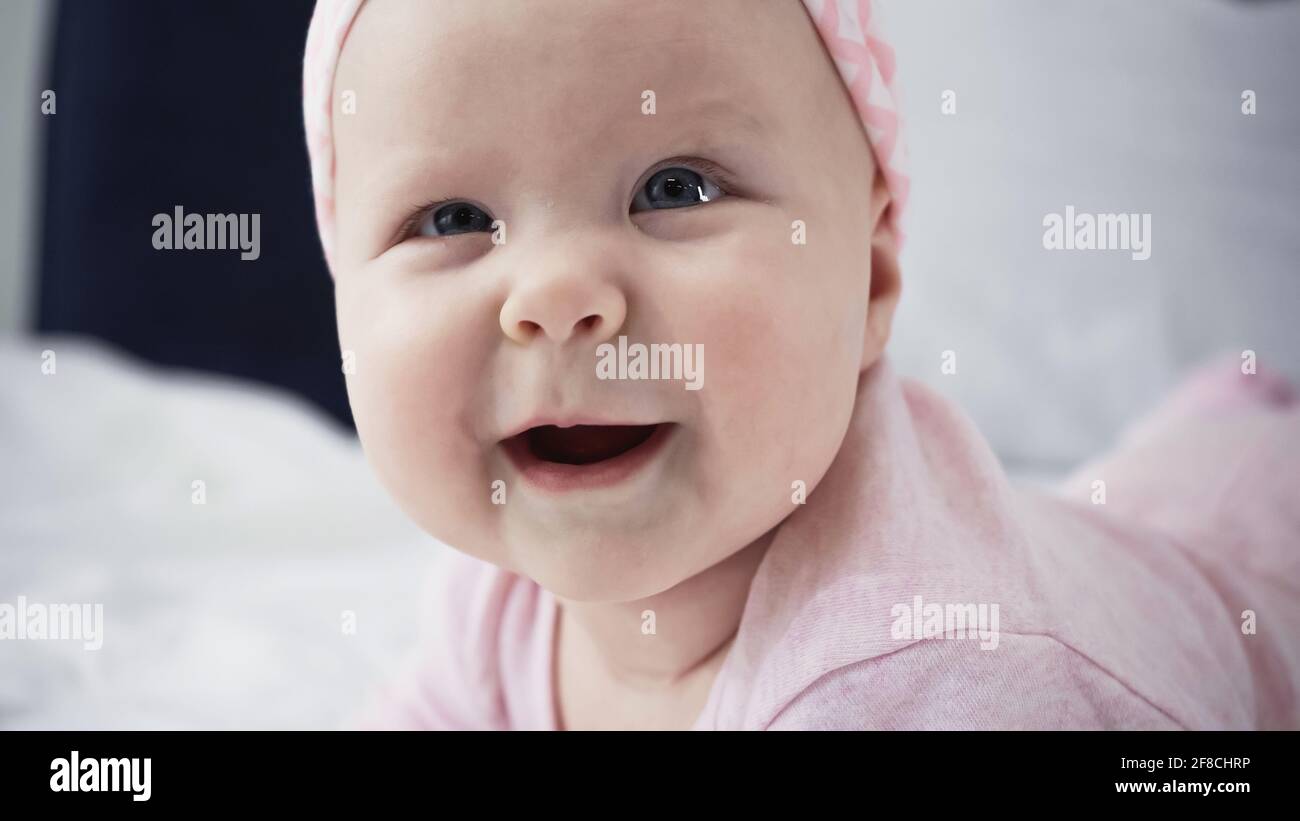 close up of funny infant baby girl looking at camera Stock Photo - Alamy