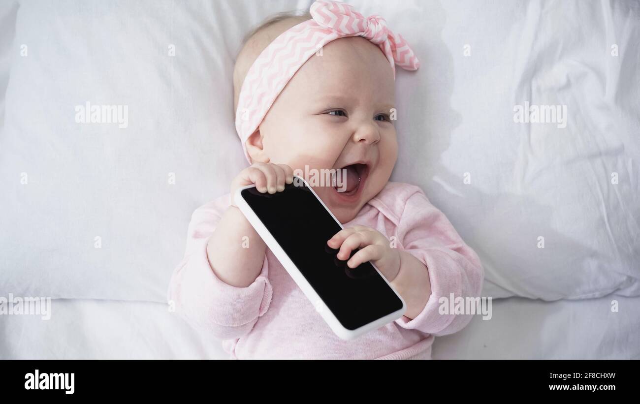 Girl holding smartphone mouth hi-res stock photography and images - Alamy