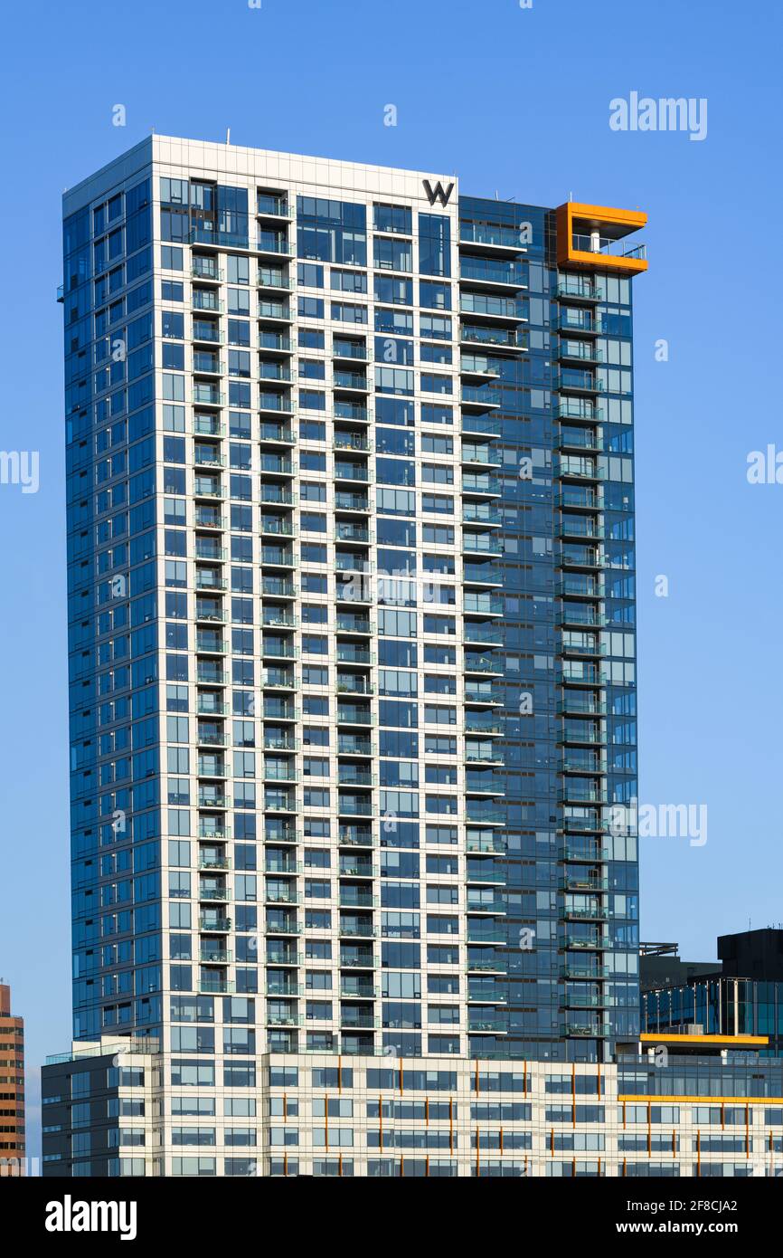 The W Hotel rising as a tower of glass windows and balconies is a ...