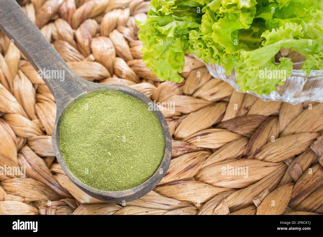 Kale powder on wooden background - Brassica oleracea var. Sabellica L ...