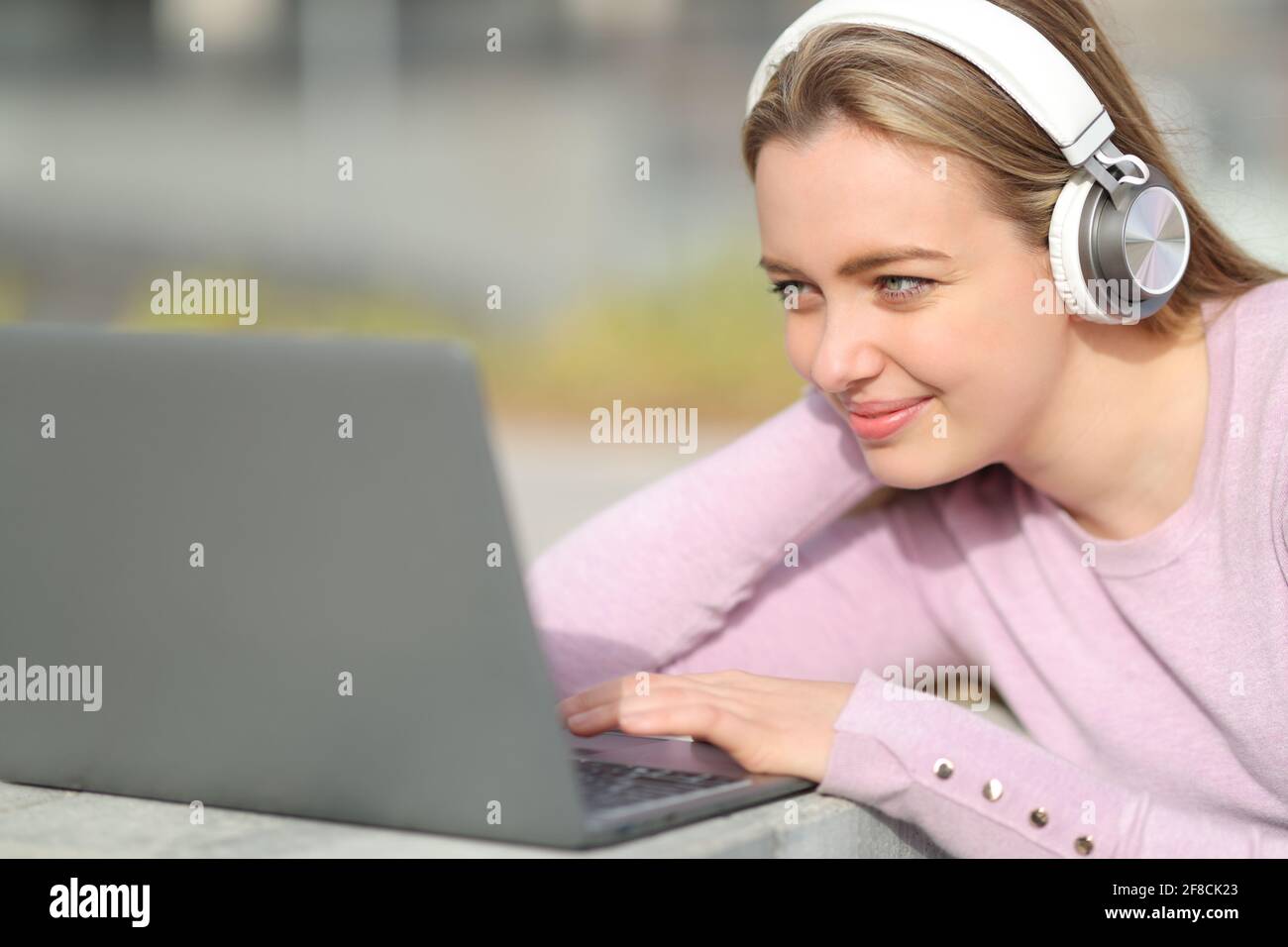 Girl wearing headphones in laptop hi-res stock photography and images ...