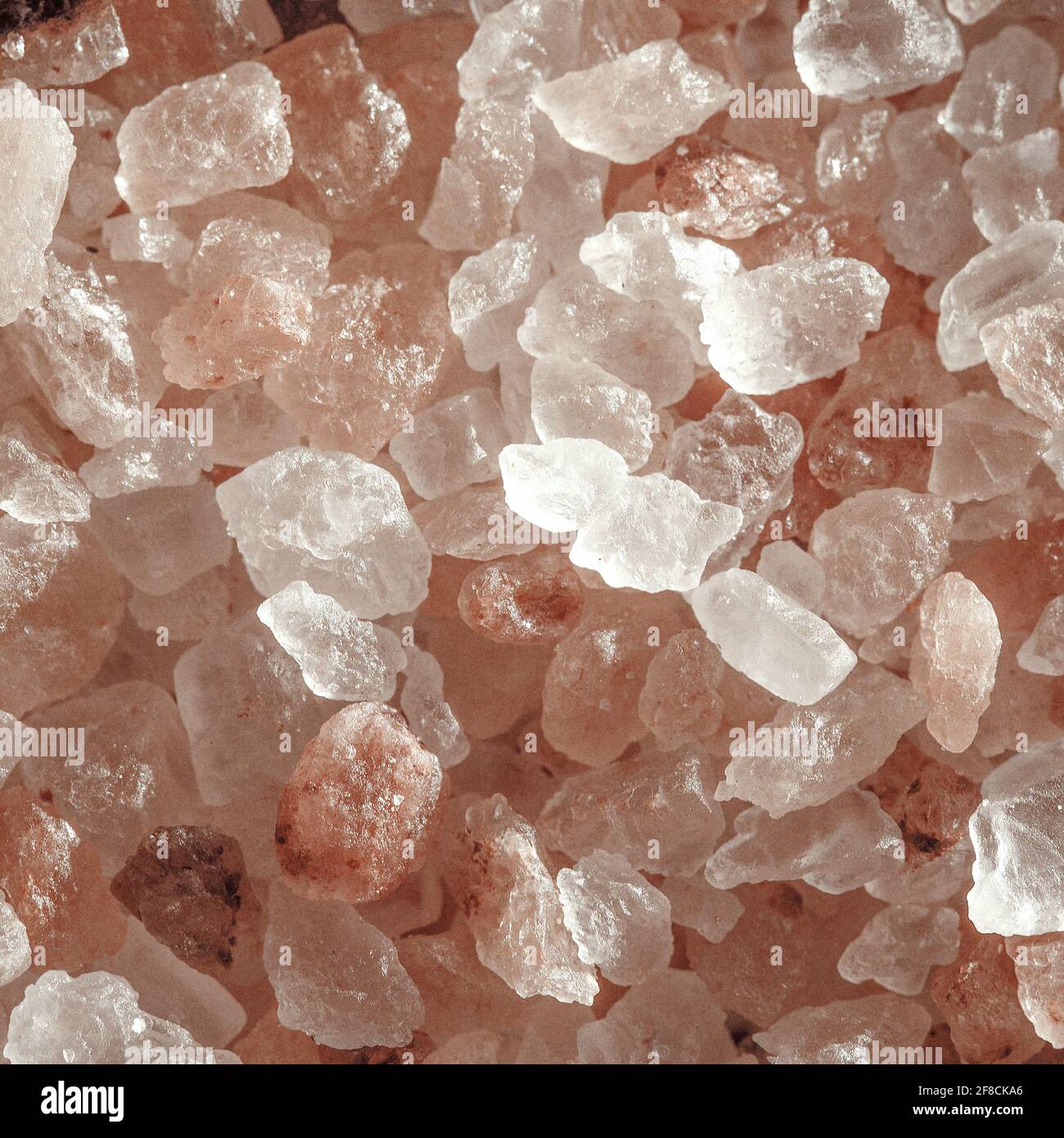 Pink himalayan salt rocks close up. Macro. Pink background. Sunlight ...
