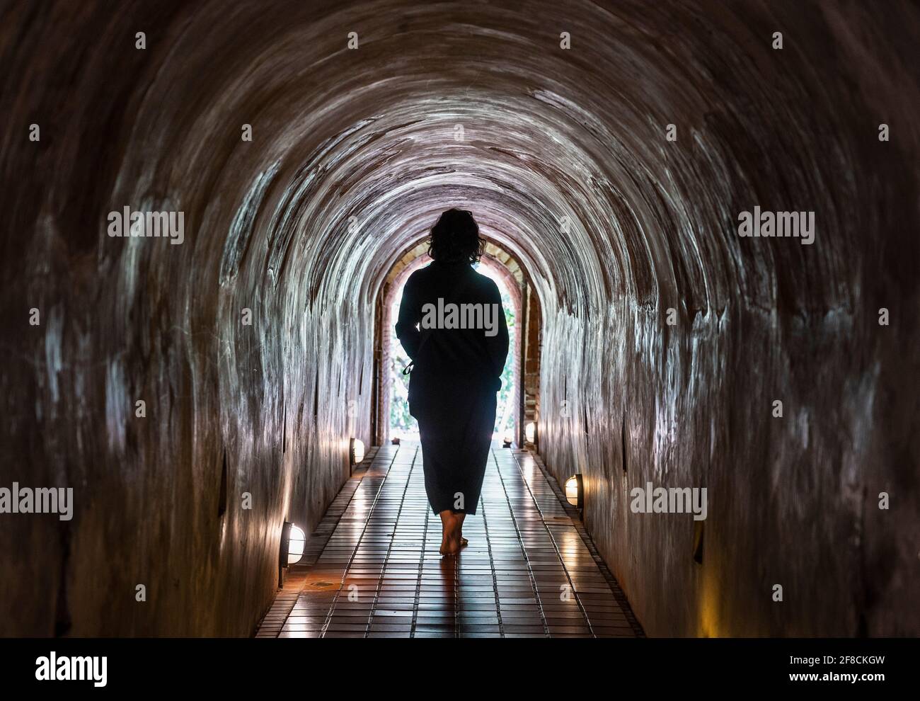 Woman walking in cave hi-res stock photography and images - Alamy
