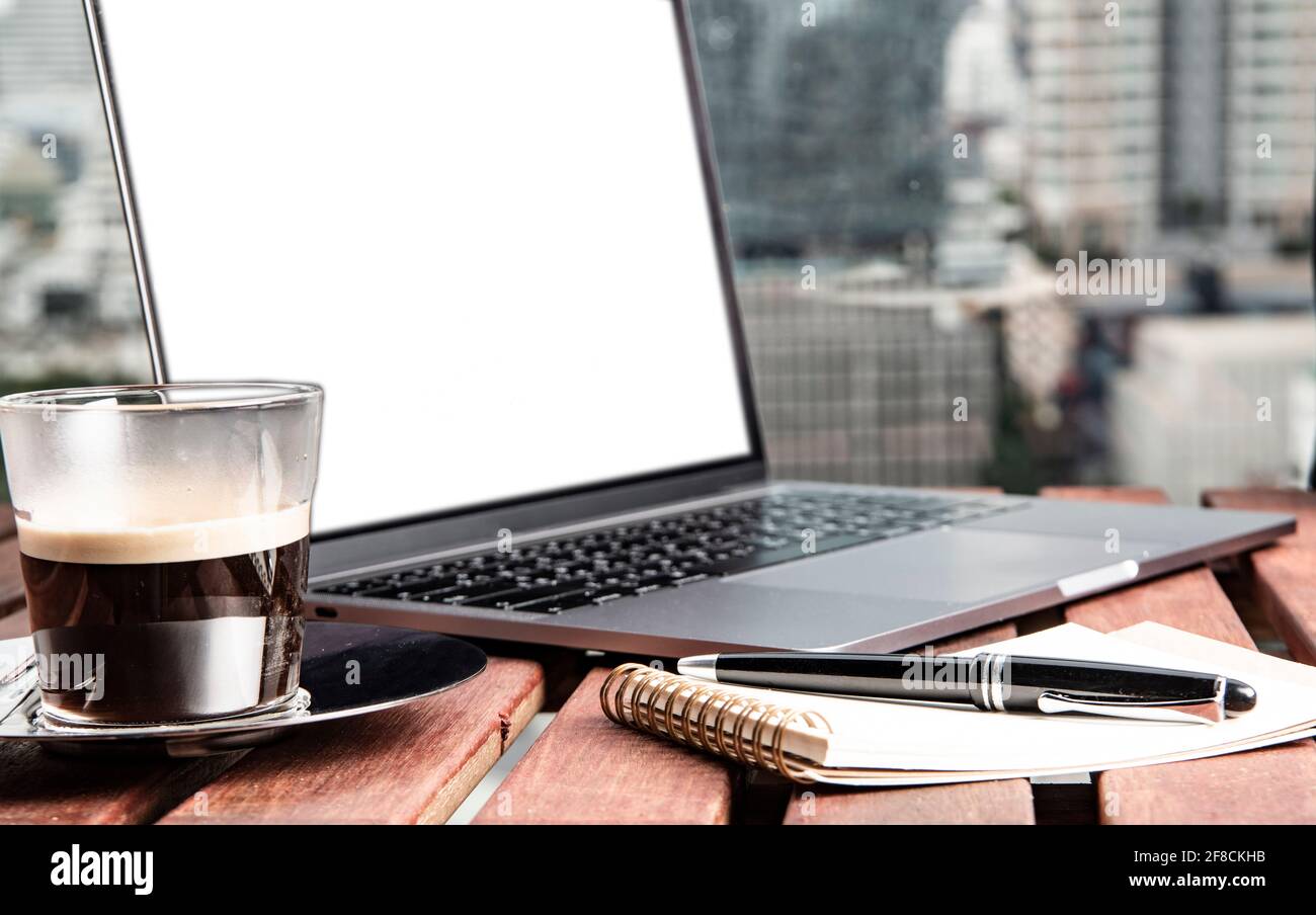 laptop, coffee and notepad for remote working in Bangkok Stock Photo ...
