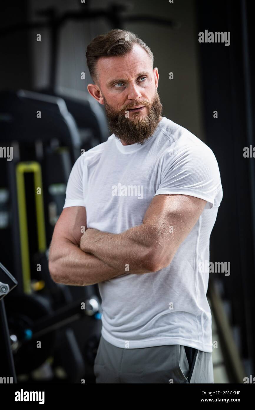 Personal trainer arms crossed in hi-res stock photography and images ...