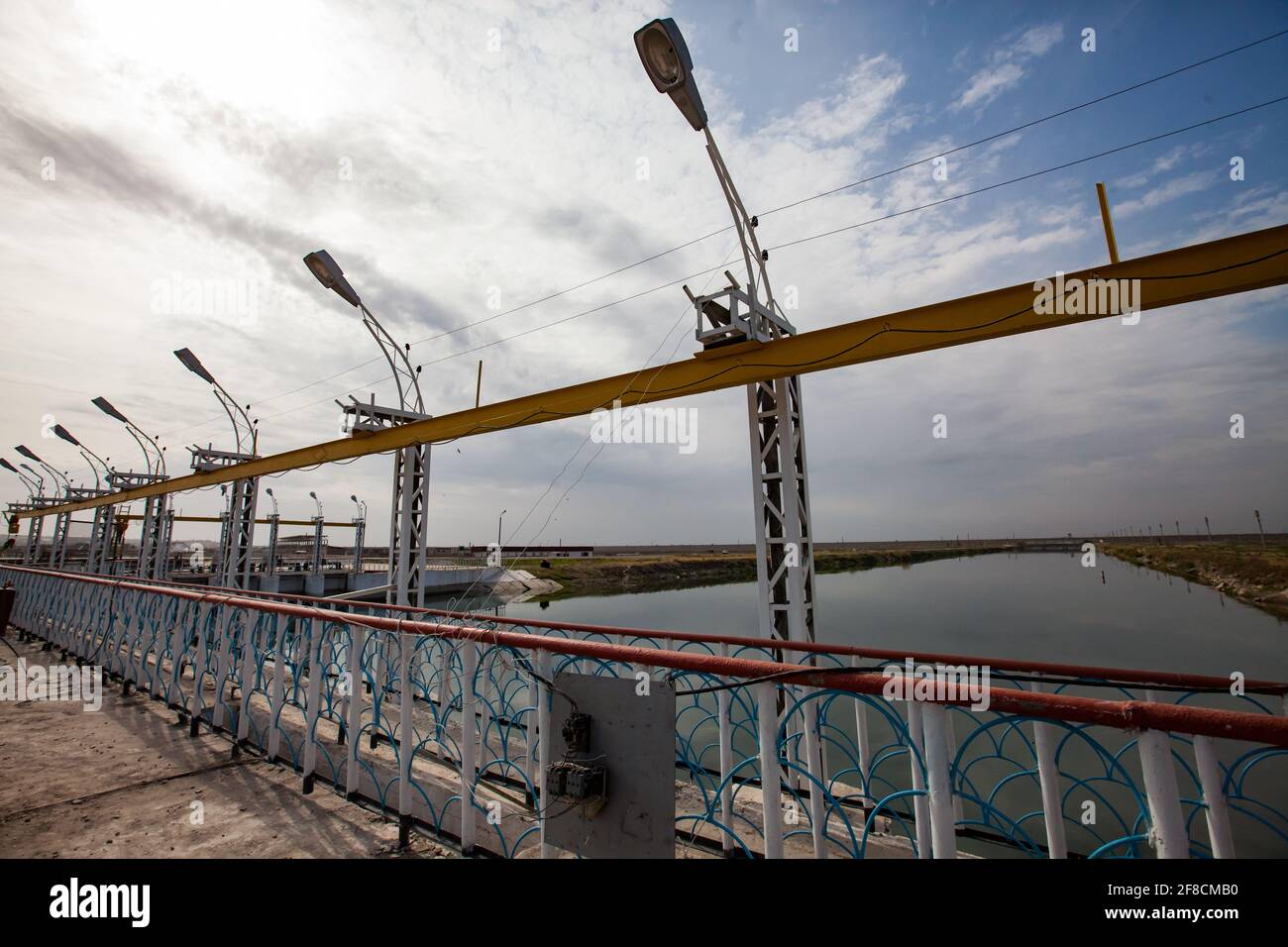 Shardara water storage dam. View from bridge. Concrete floor, lightings ...