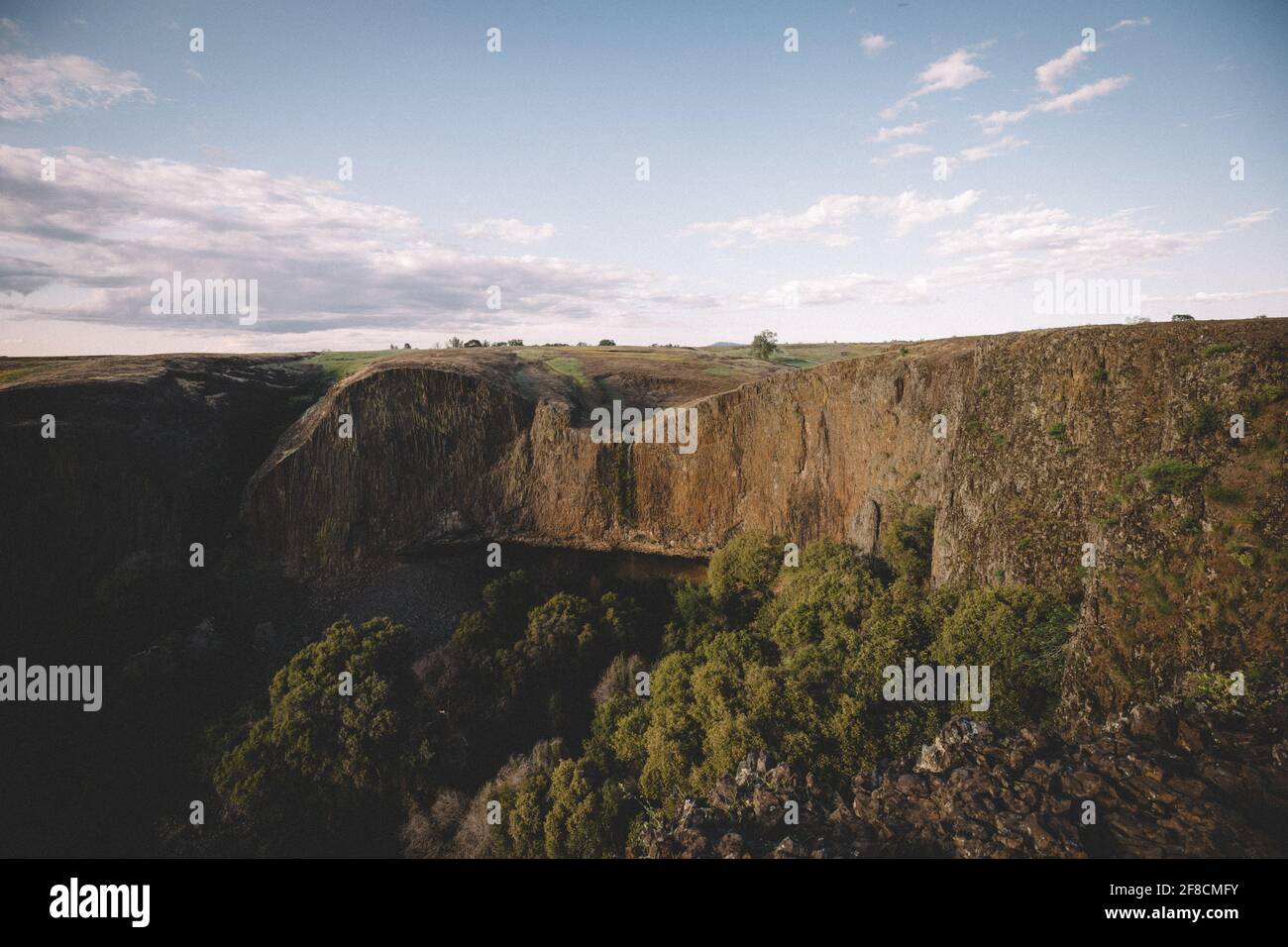 Phantom Falls Trickle over the Cliff Edge at Sunset on Table Mountain ...