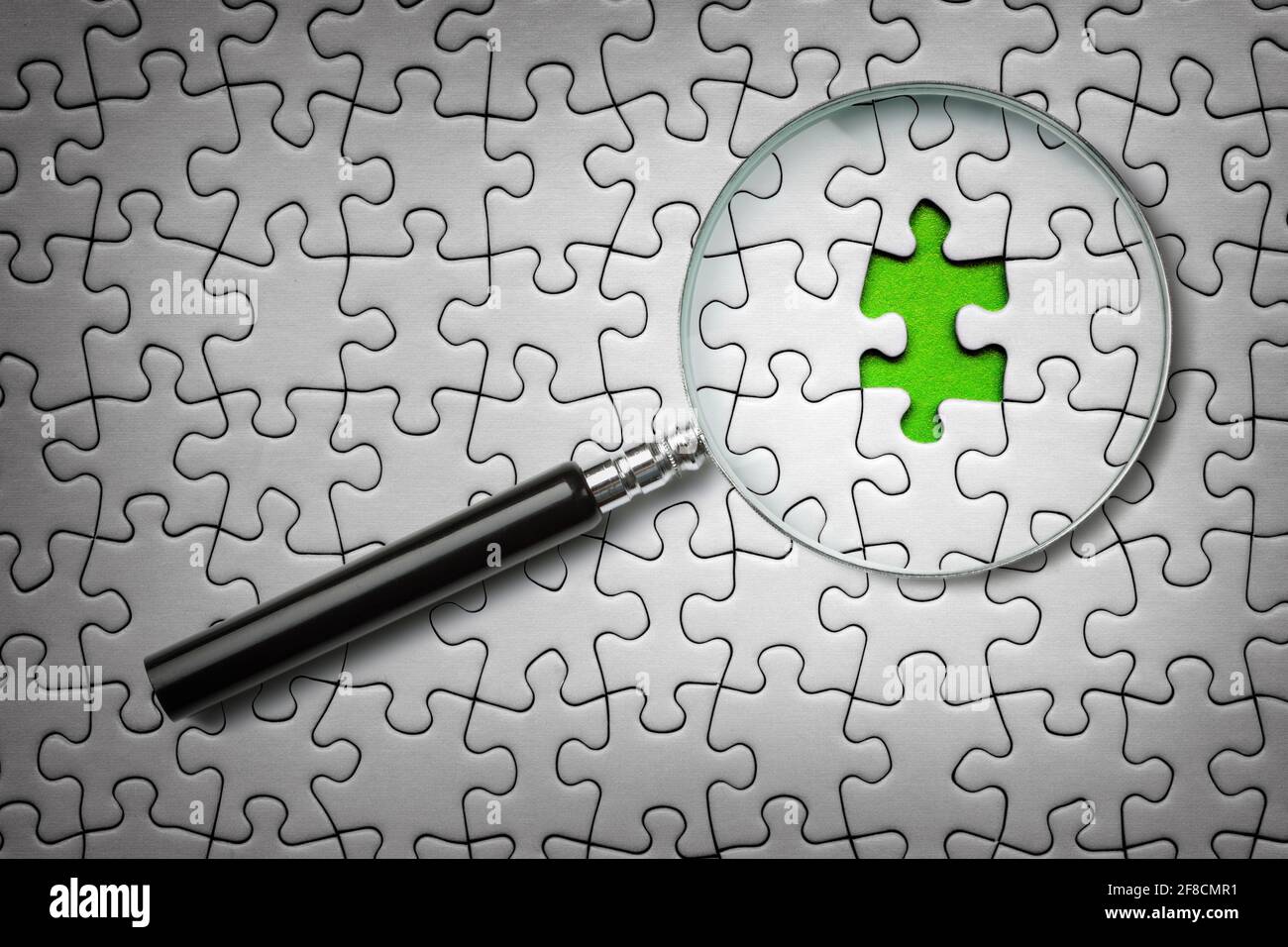 Searching for missing last puzzle piece with a magnifying glass Stock ...