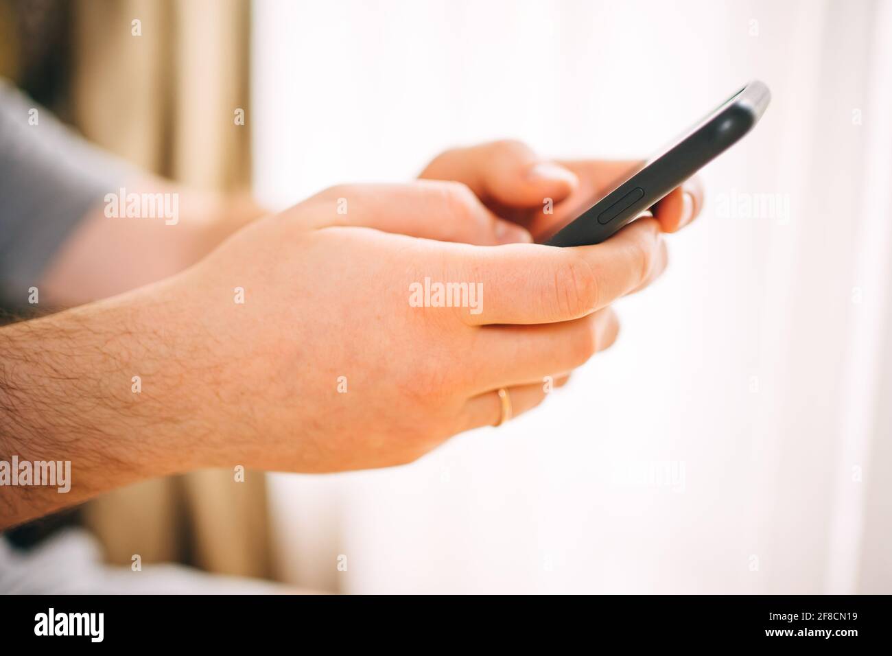 a man holding a mobile phone Stock Photo - Alamy
