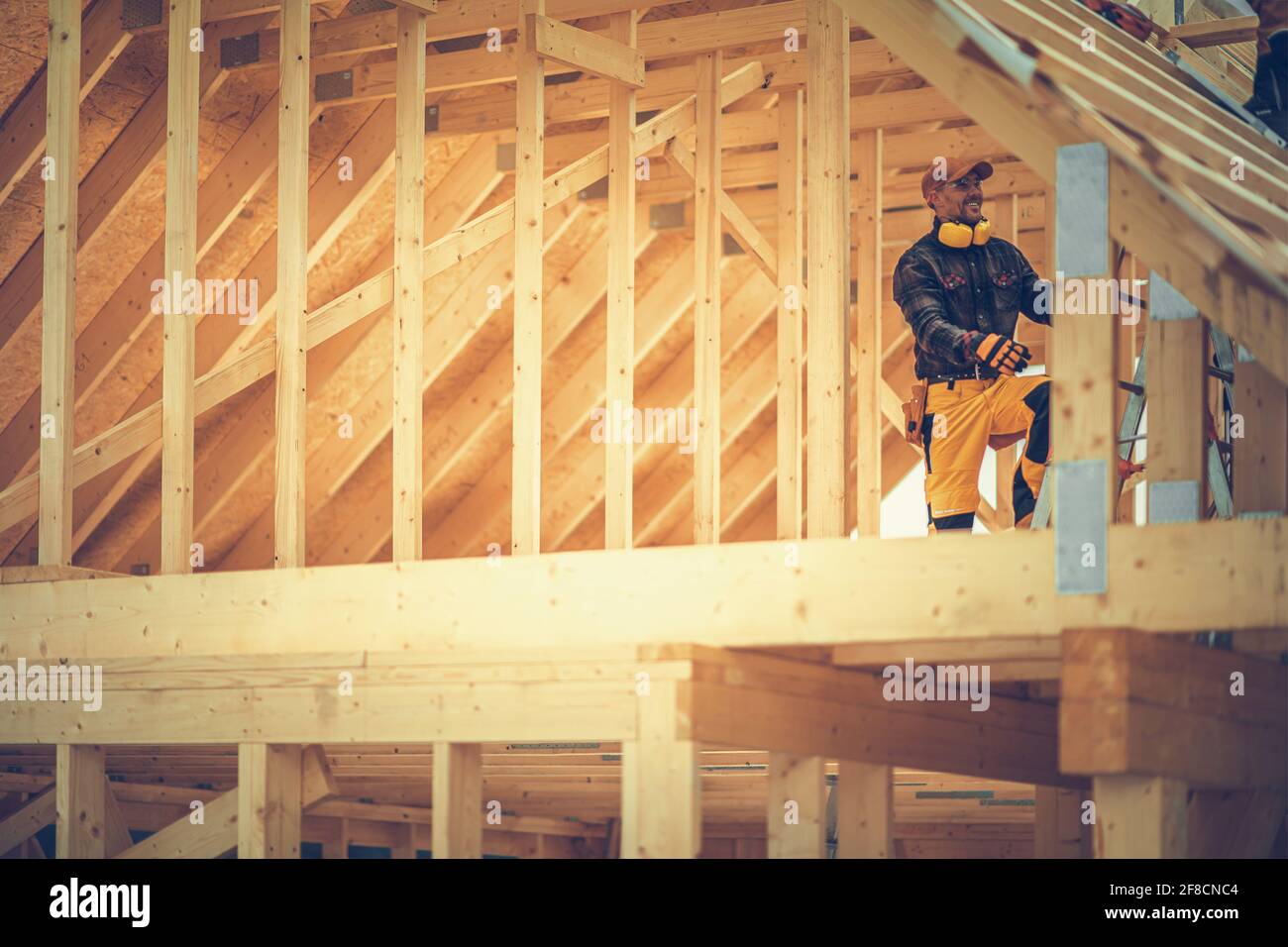 Smiling Construction Contractor Inside Newly Constructed Wood Skeleton ...