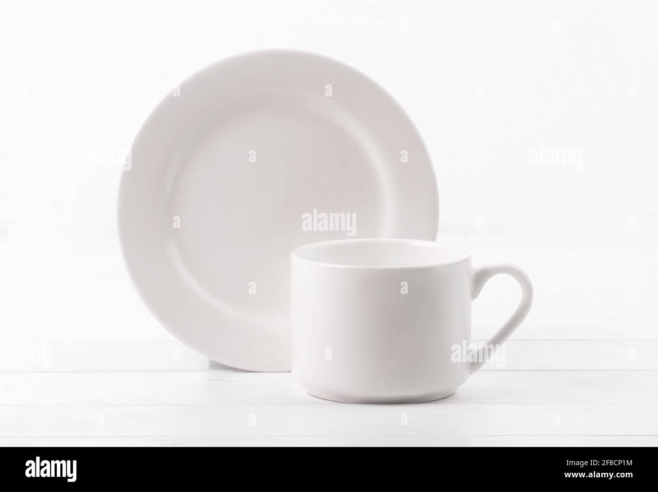 White porcelain cup and plate Stock Photo - Alamy