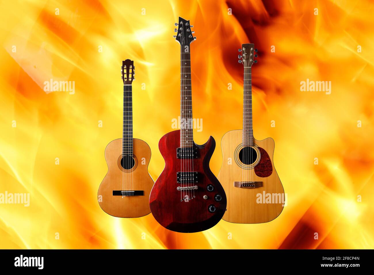 Set of different guitars on a fire flame background Stock Photo - Alamy