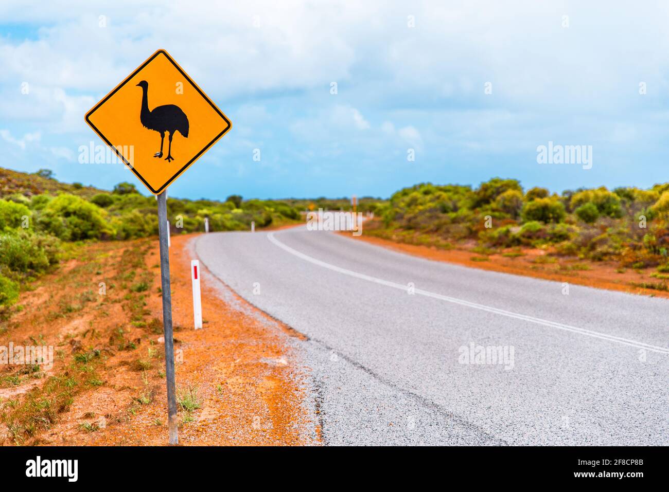 Beware of emu road sign in the Australian outback with bushland in the ...