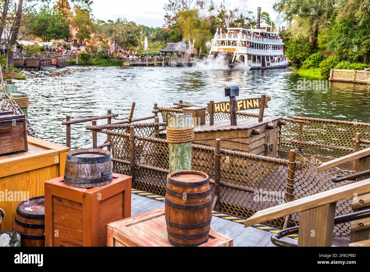 Beautiful stream boat in the river and lake. The dock has barrels and ...