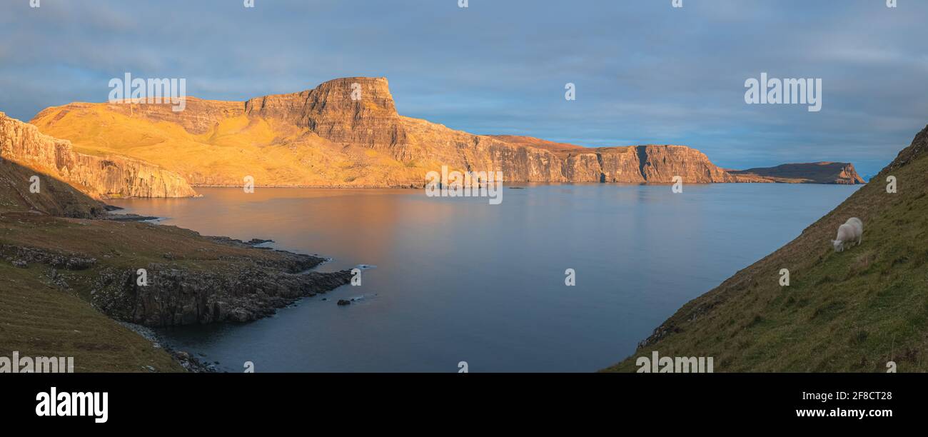 Dramatic golden light on seascape panorama view of Waterstein Head ...