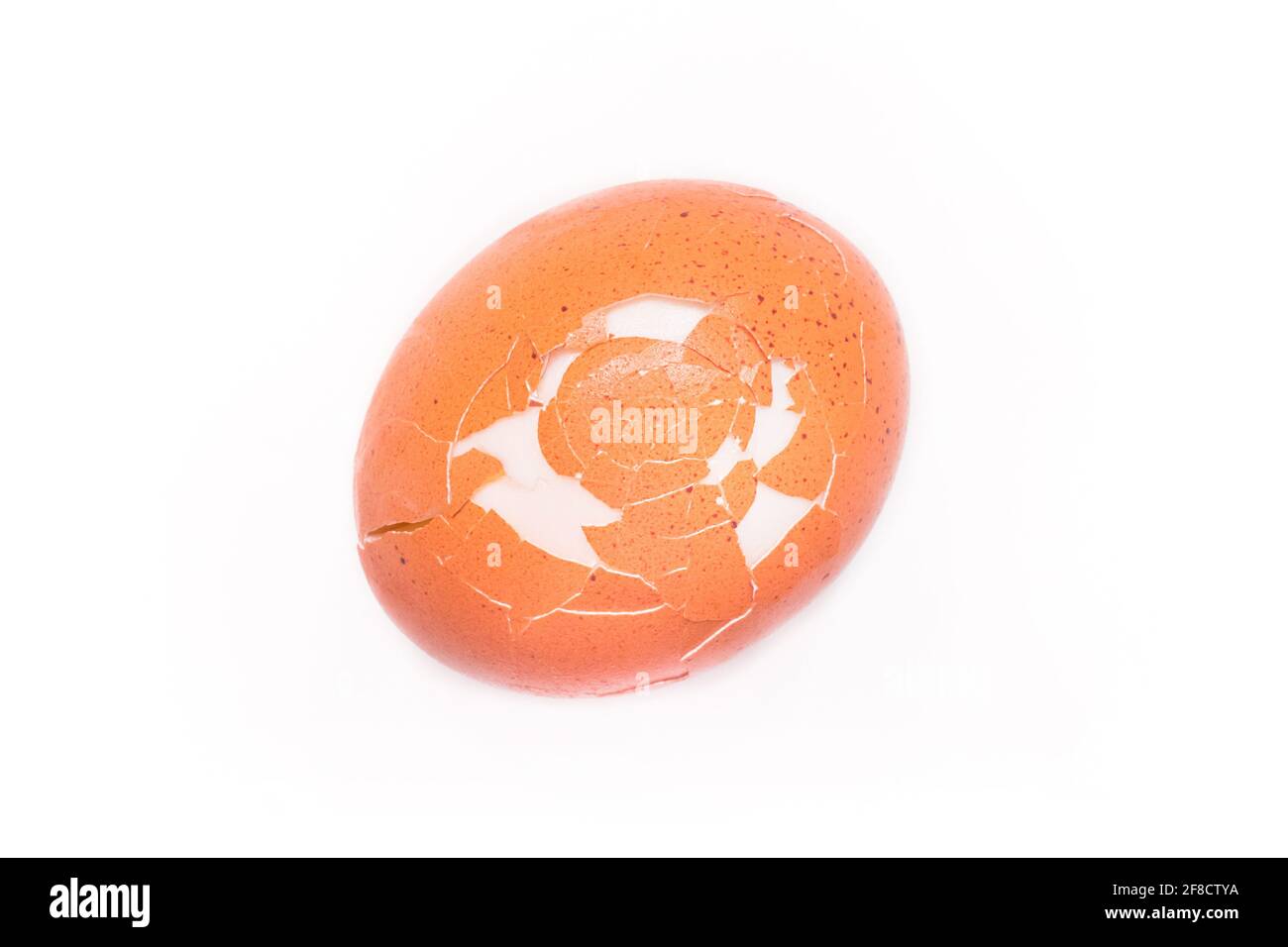 Broken, cracked boiled chicken egg isolated on white background, close ...