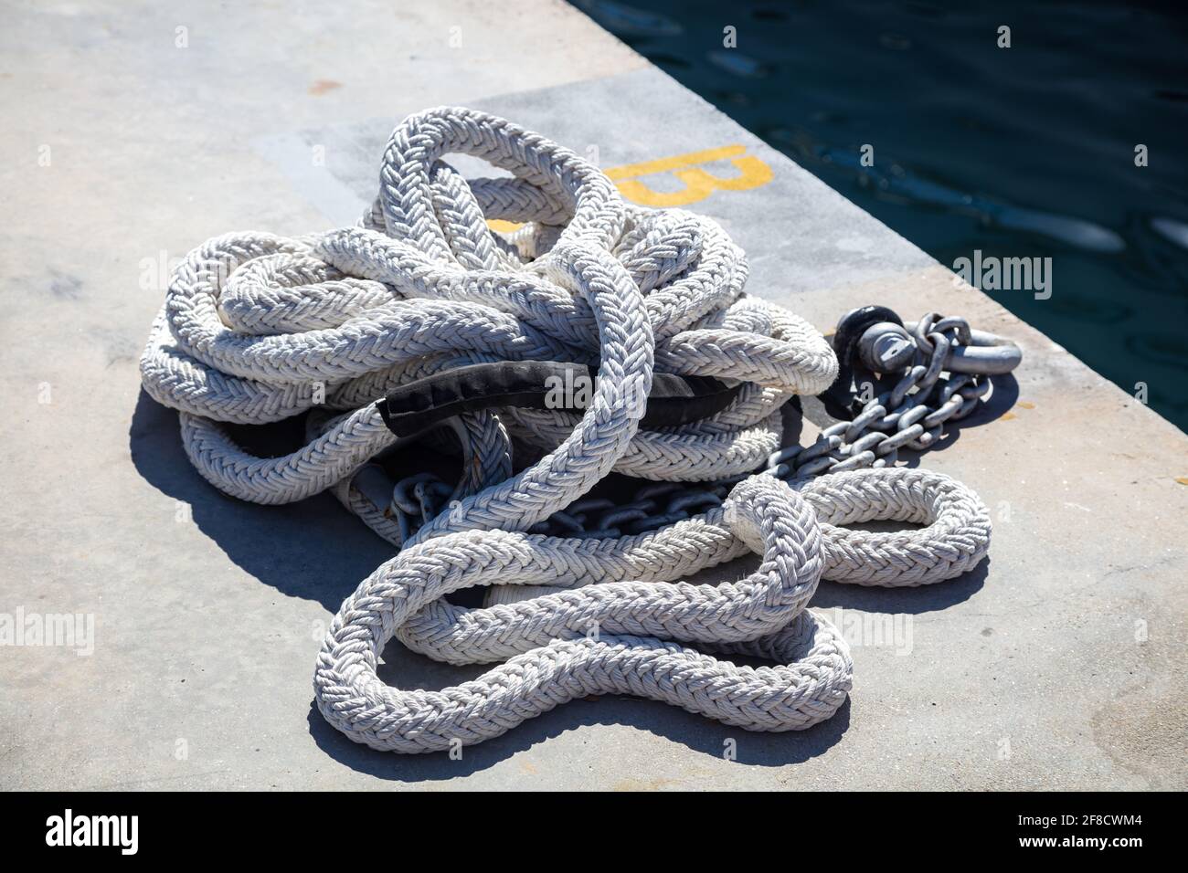Mooring rope white color on concrete floor, luxury yachts marina pier ...