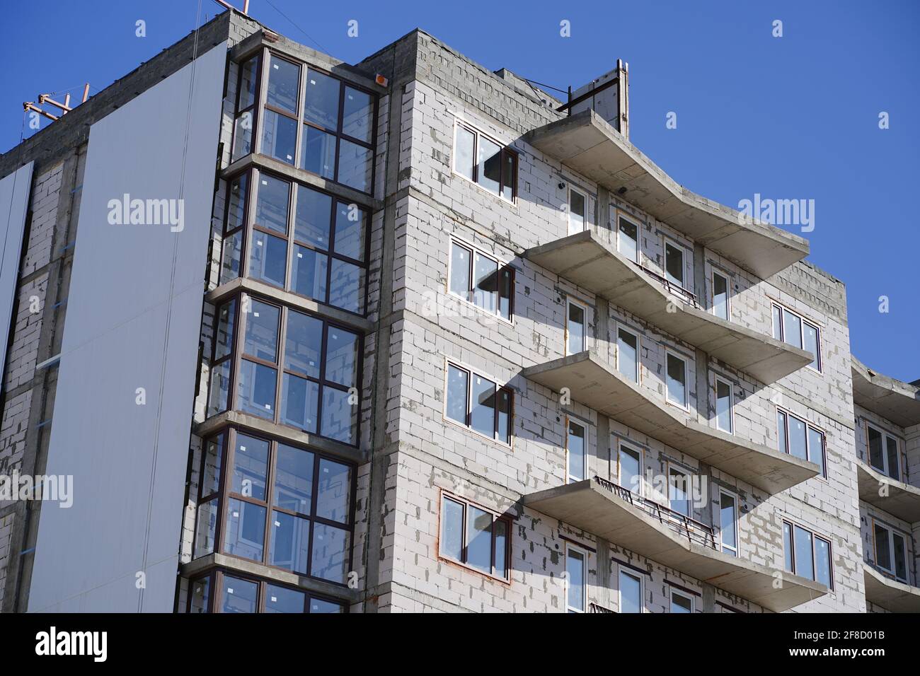 Close up of construction residential building on background of blue sky ...