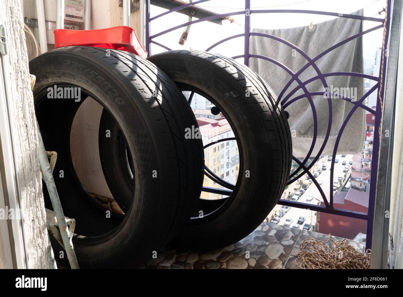 Car tires on the balcony Stock Photo - Alamy