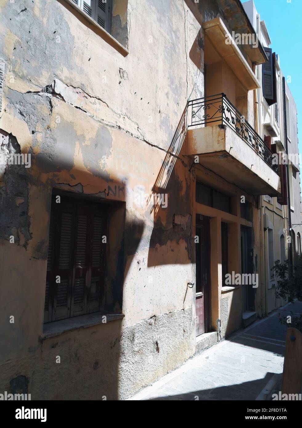 Crete, Greece: Abandoned damaged wall of worn out painted building with ...