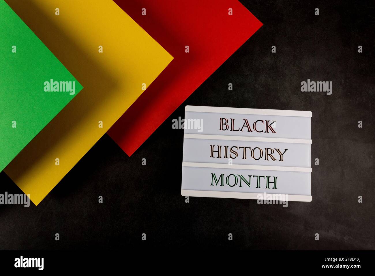 Black History Month. Red, yellow and green color paper on the black ...