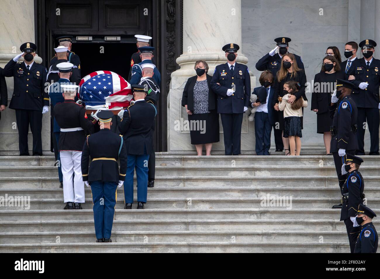 The family of US Capitol Police Officer William "Billy" Evans looks on ...