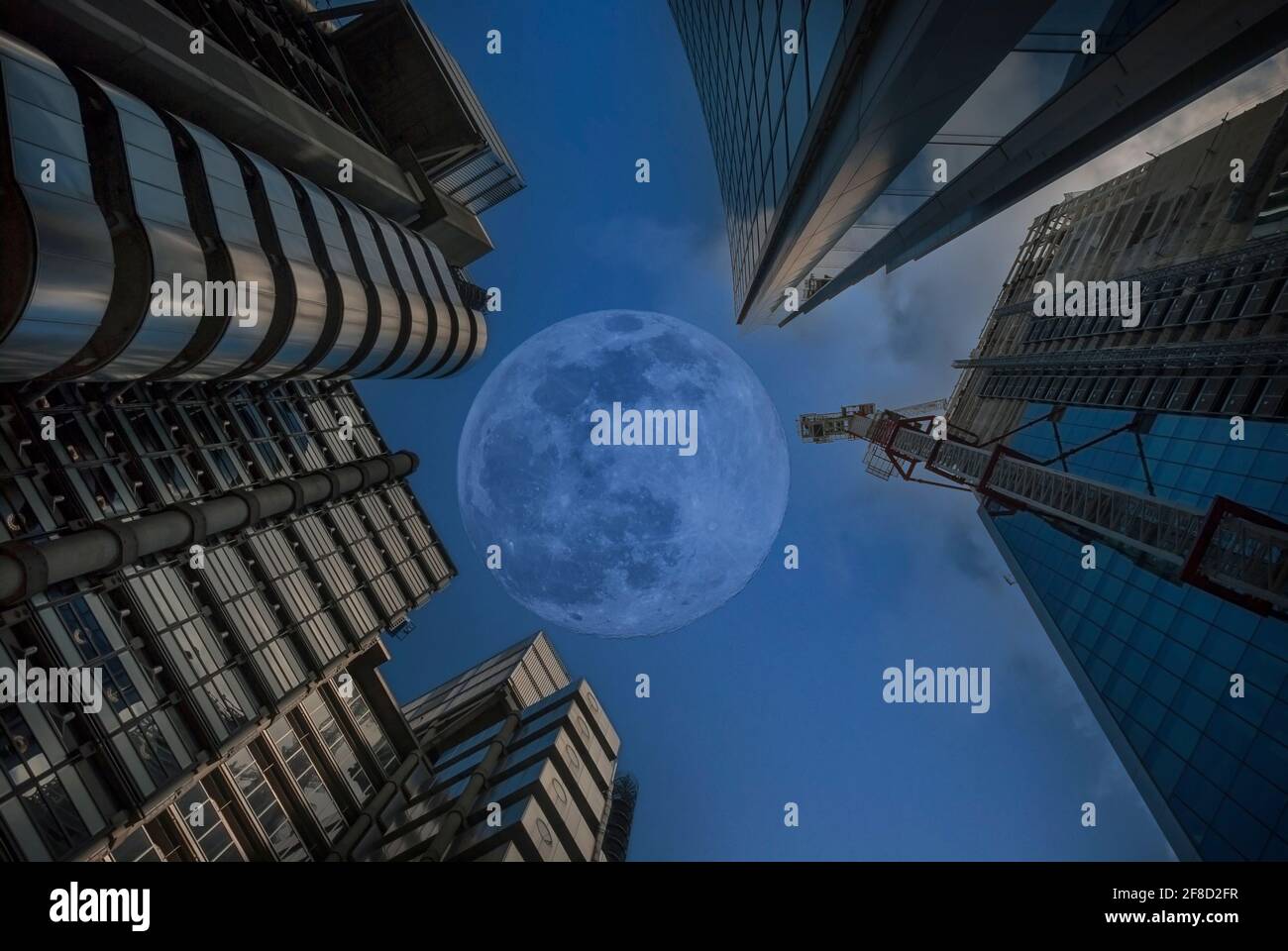 A full moon surrounded by modern office buildings in London, UK Stock ...