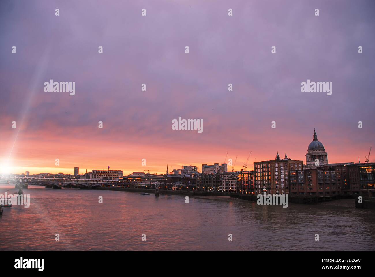 The iconic dome of St Pauls Cathedral on the London skyline at sunset ...