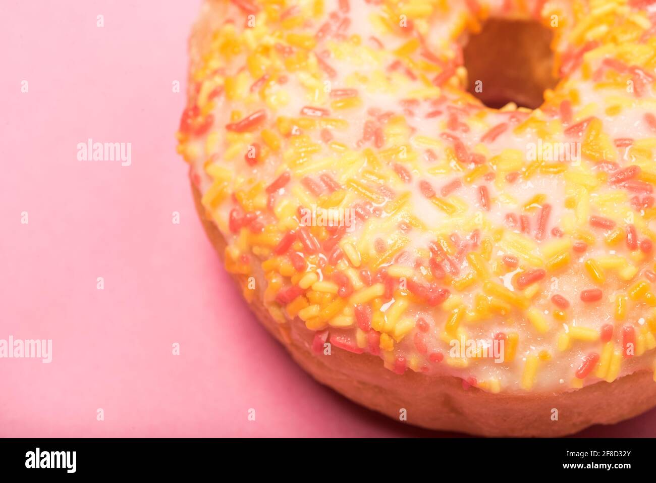 Close up of a colourful iced ring doughnut with sprinkles Stock Photo ...