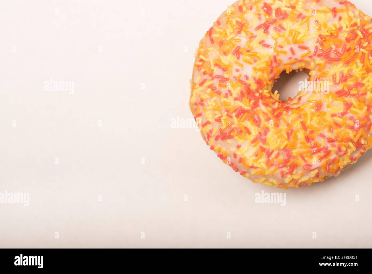 Close up of a colourful iced ring doughnut with sprinkles Stock Photo ...