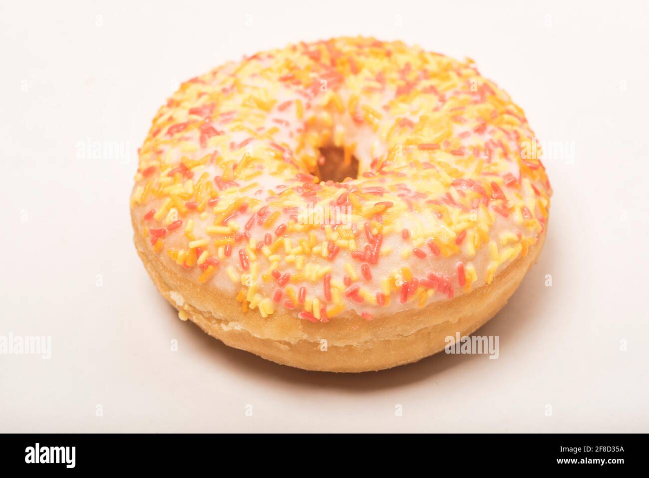 Colourful iced ring doughnuts with sprinkles Stock Photo - Alamy