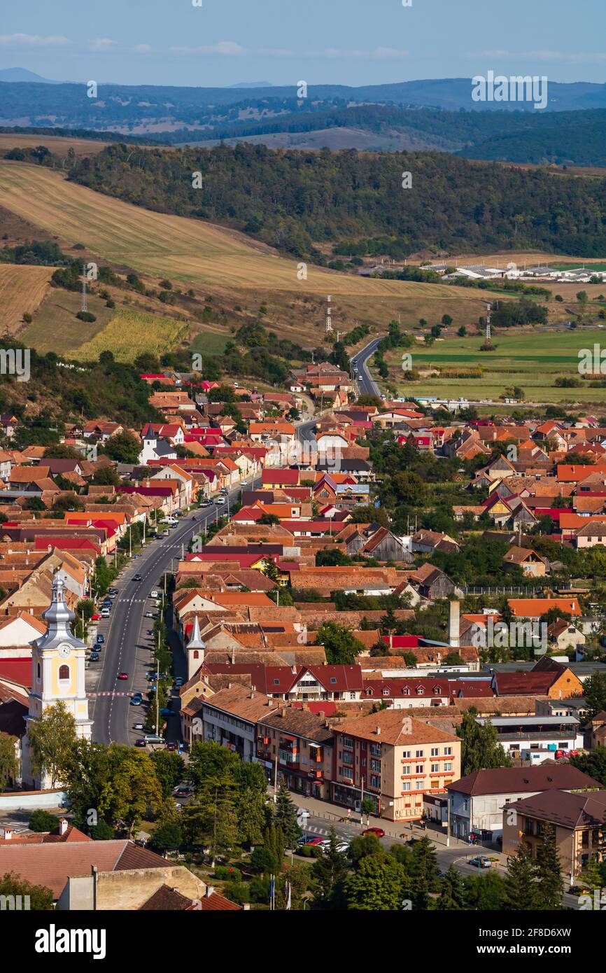 Aerial view of the town center with hills, buildings, streets ...