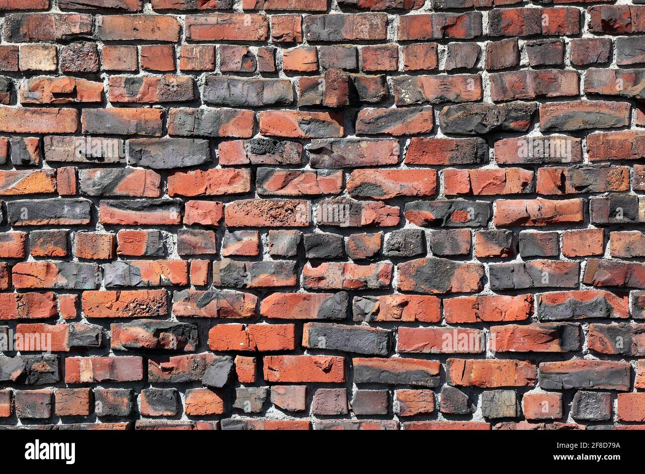Full frame background red brick wall scorched by fire Stock Photo - Alamy